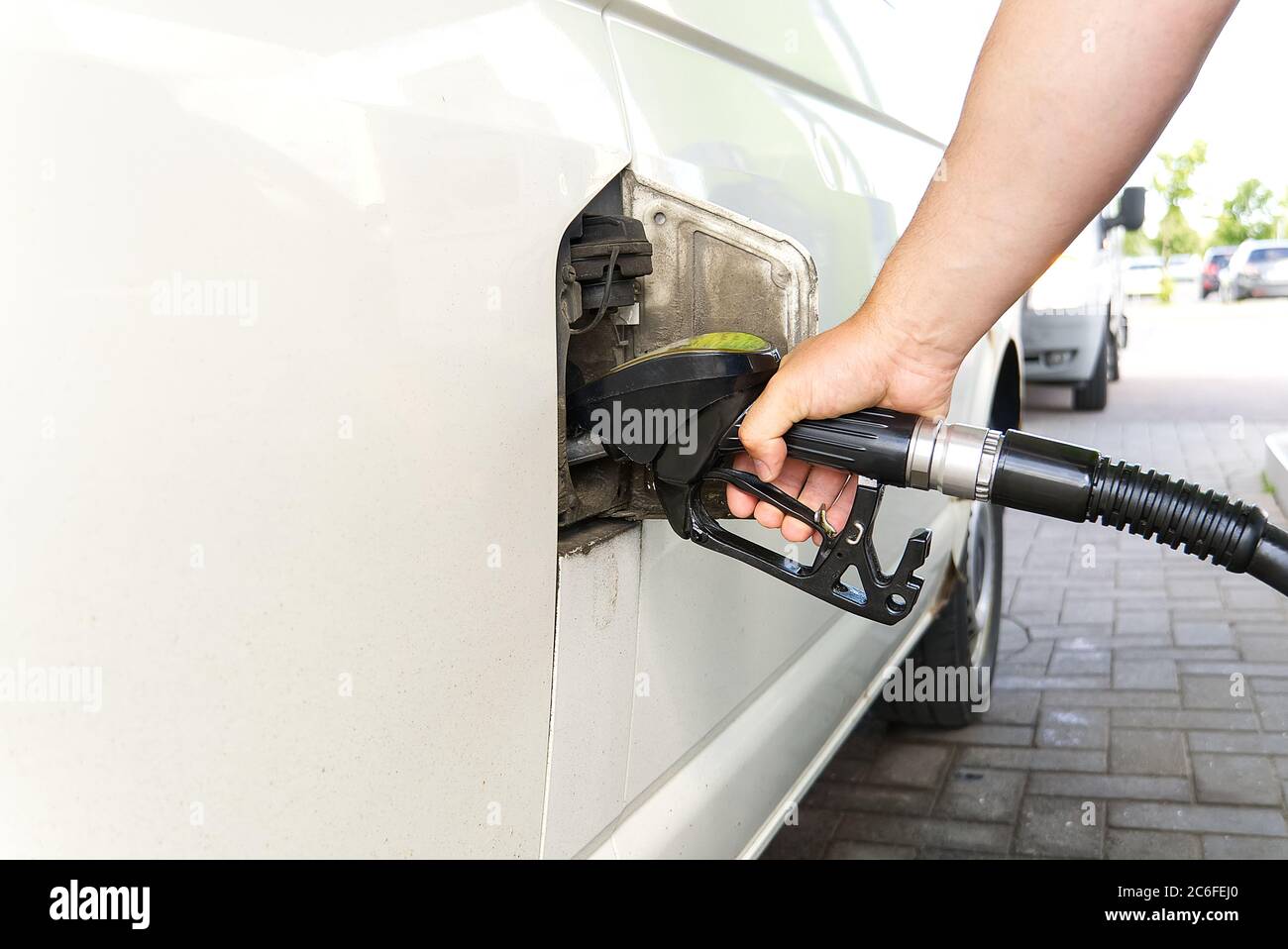 Man at price panel of filling station hi-res stock photography and ...