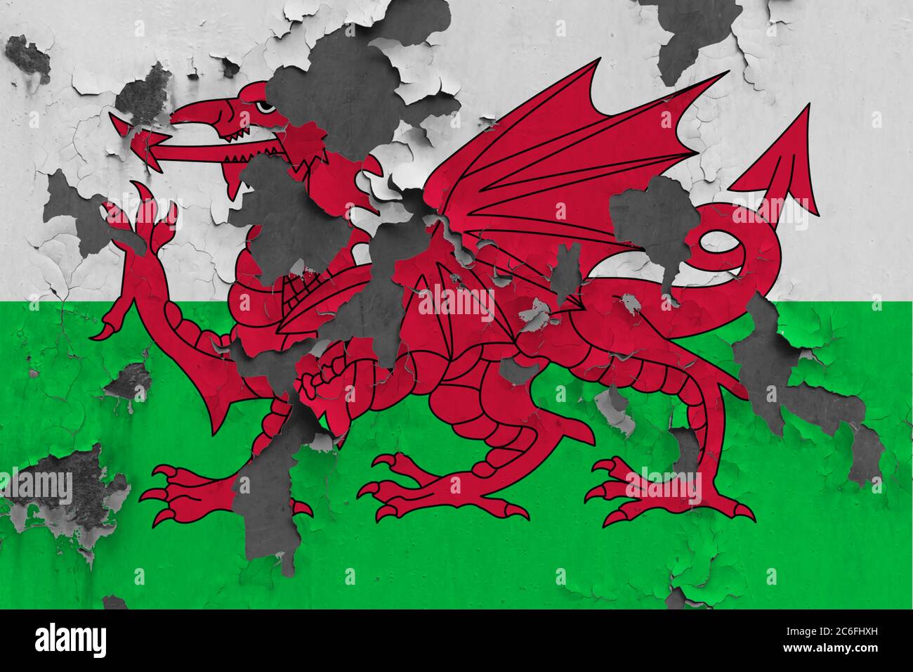 Wales flag close up painted, damaged and dirty on wall peeling off ...