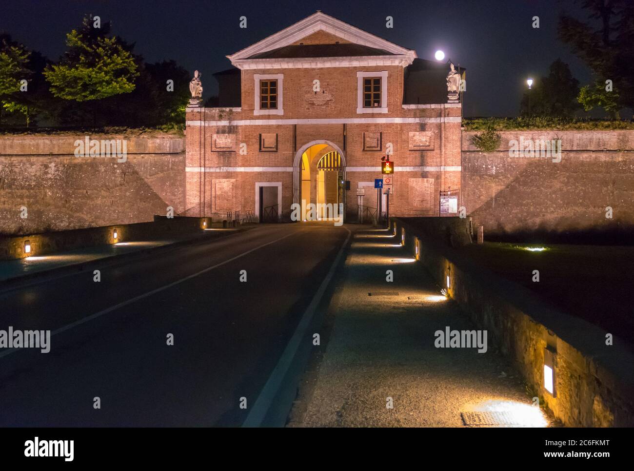 Lucca, Italy - August 16, 2019: Night view of the medieval surrounding ...