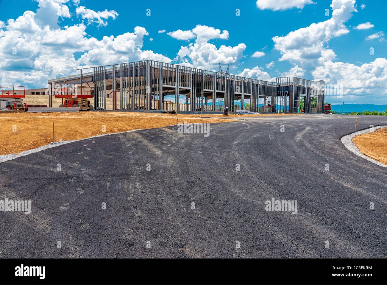 Horizontal shot of commercial building under construction with a drive ...