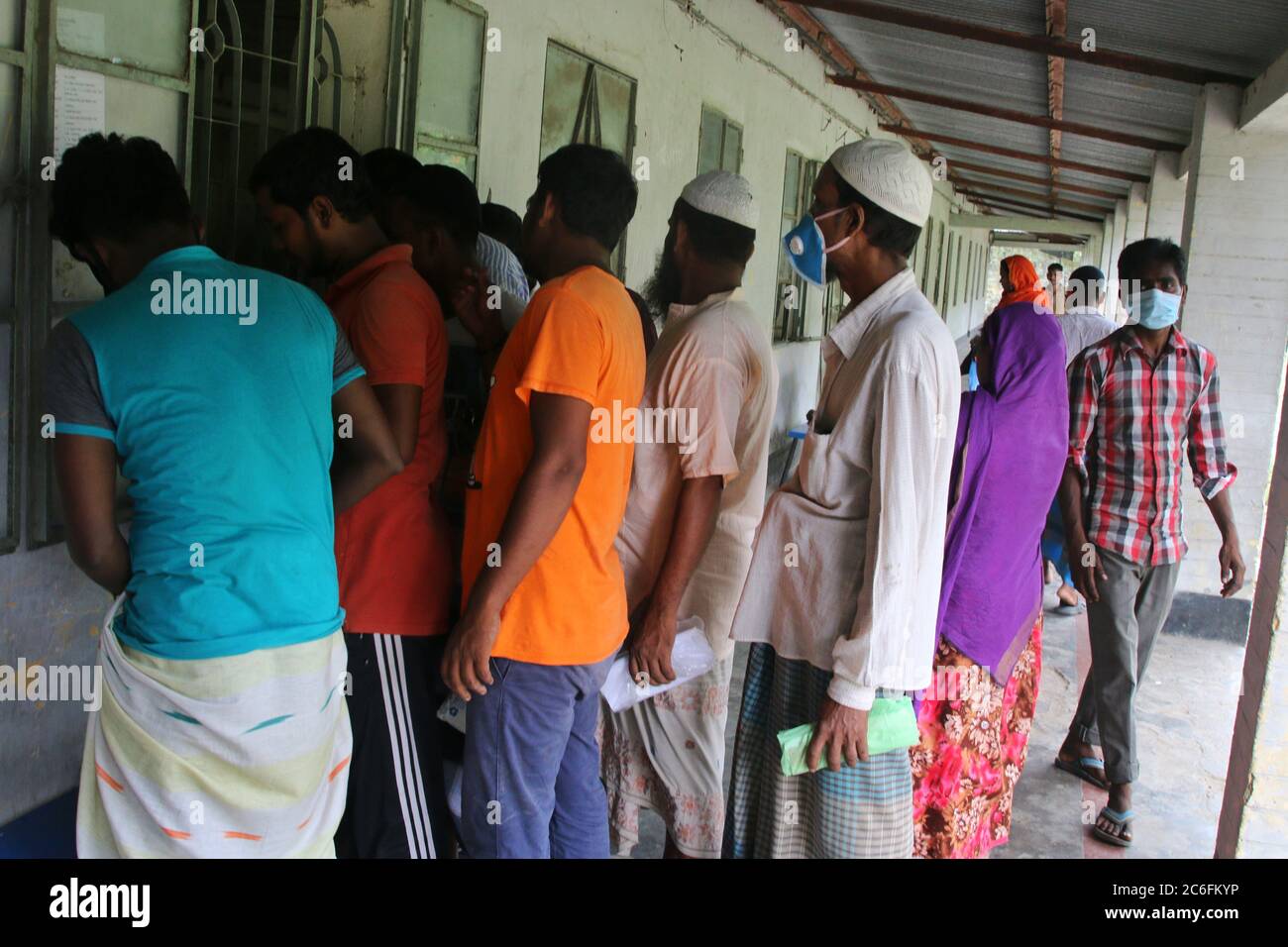 July 9, 2020, Dhaka, Bangladesh: Workers in a queue to create bank ...