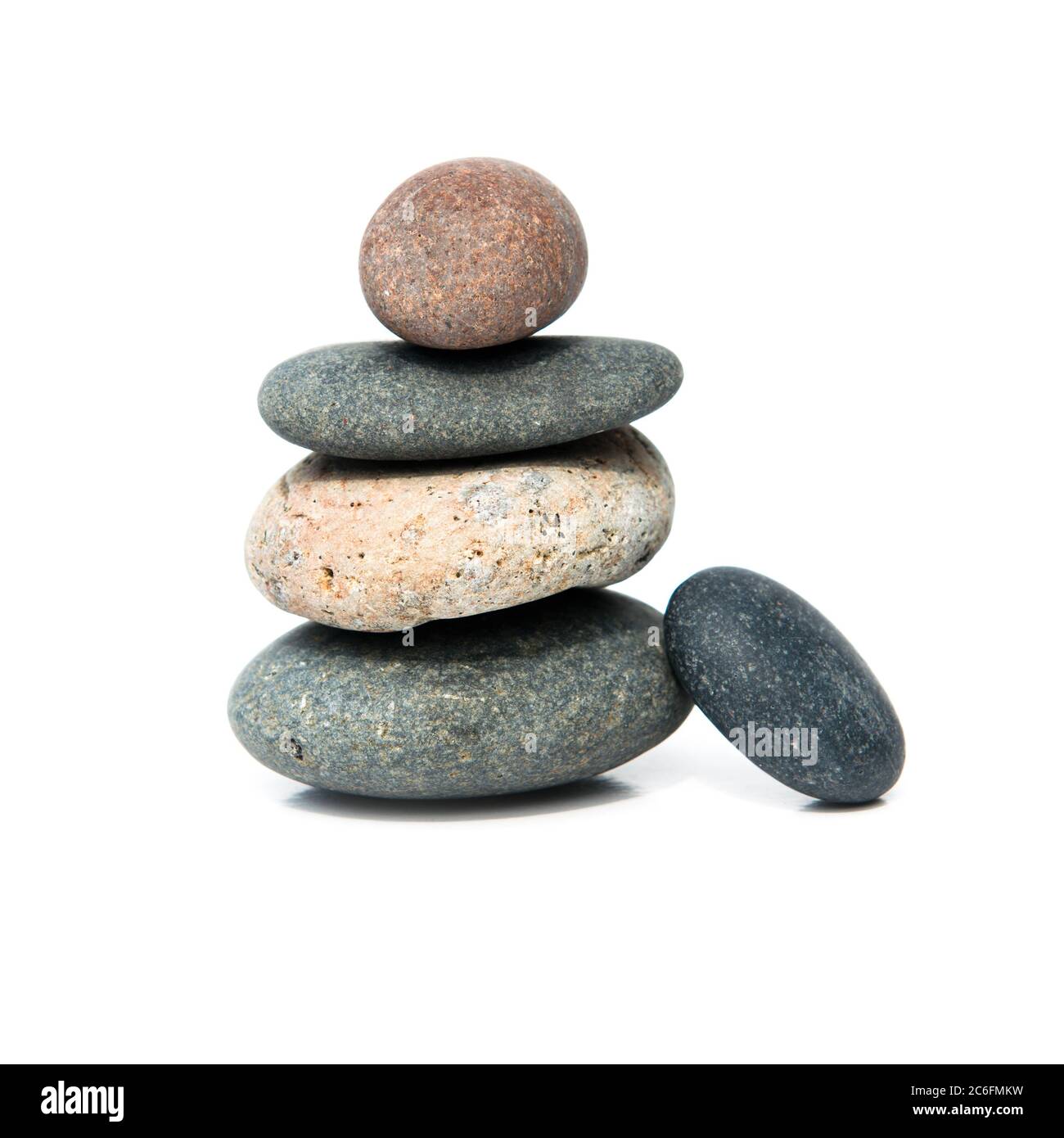 Pyramid from Icelandic pebbles, balancing rocks on white background ...