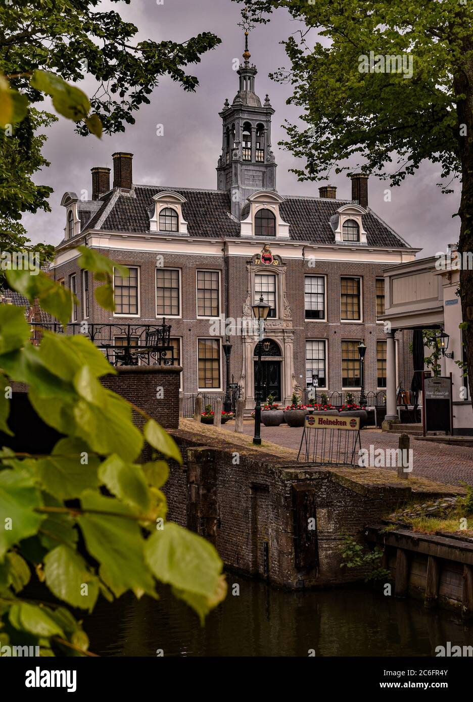 The beautiful Sint Janskerk in Gouda framed by trees Stock Photo - Alamy