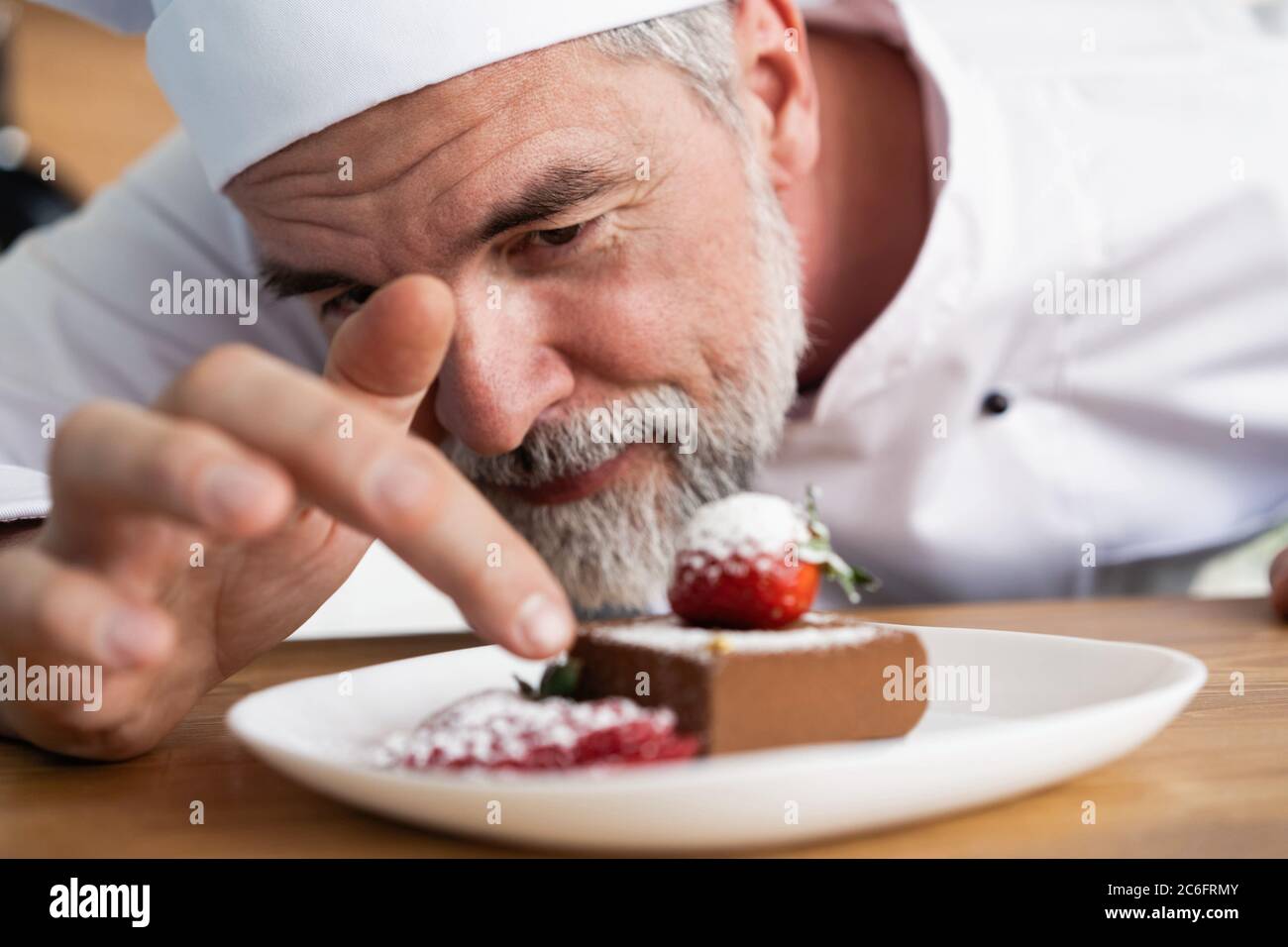 Close up pastry chef decoration delicious dessert dish, serving for ...