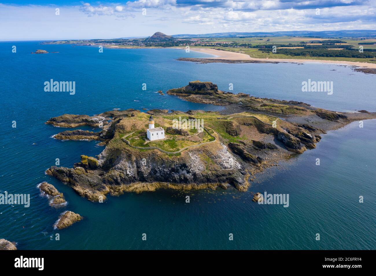 Aerial view of Fidra Island and lighthouse on Firth of Forth in East ...