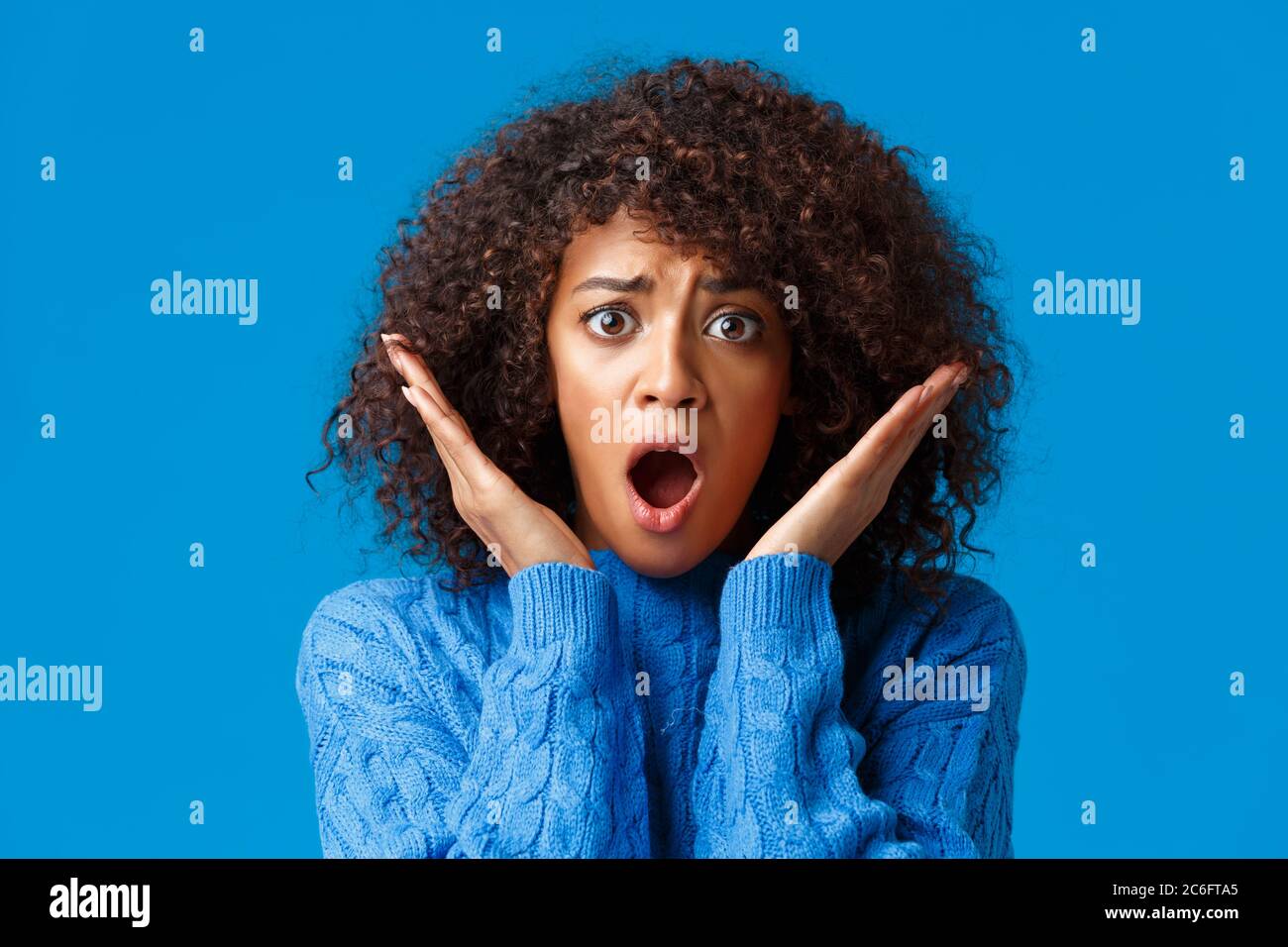 Close-up panicking, troubled and shocked african-american woman with ...