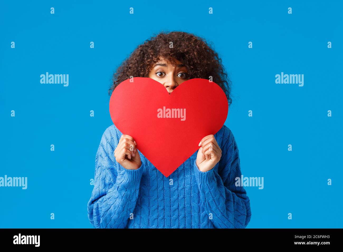 Shy and flushed cute girl scared confess to girl she loves her, holding ...