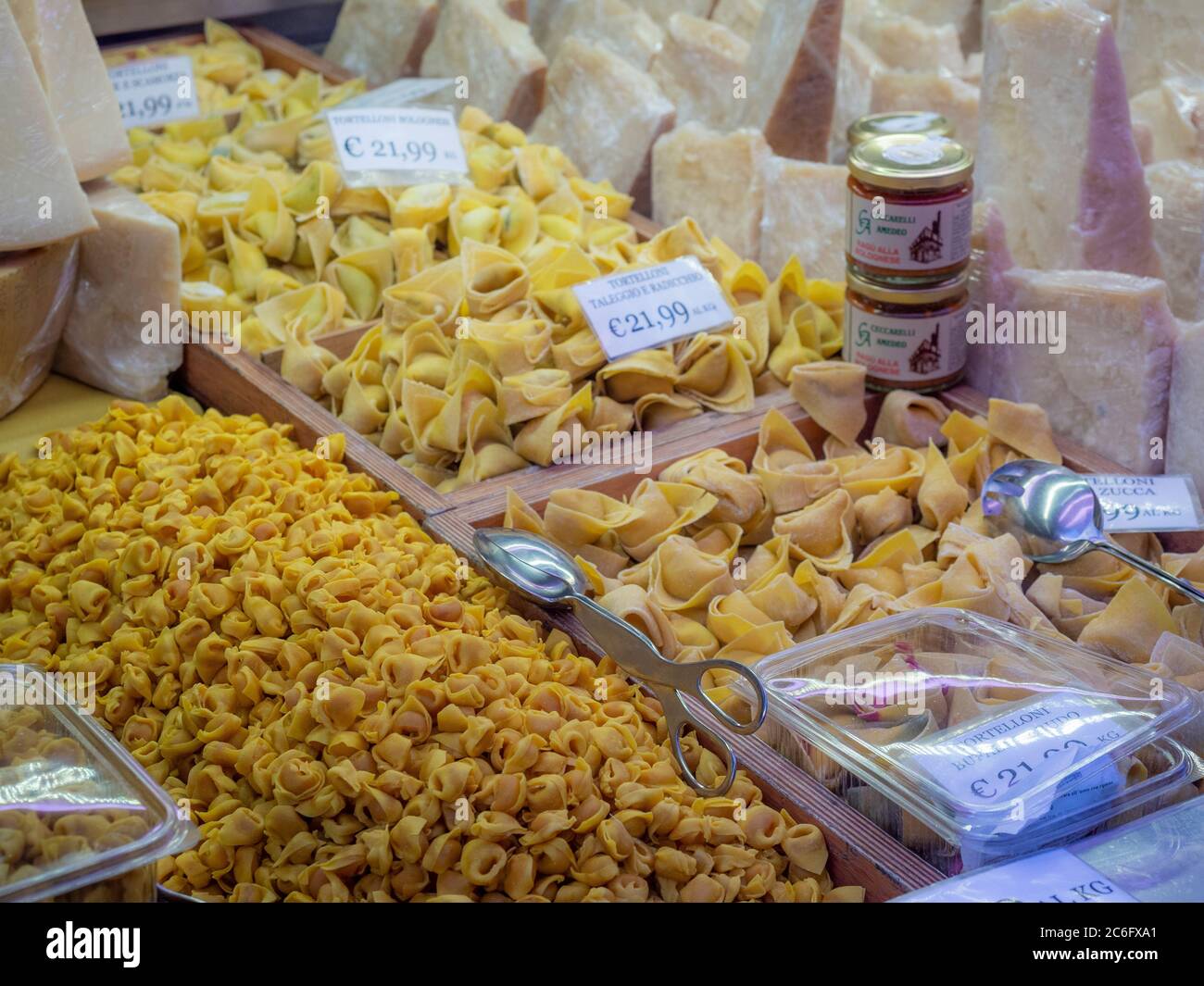 Pasta and cheese display in a shop on Via Pescherie Vecchie. Bologna ...