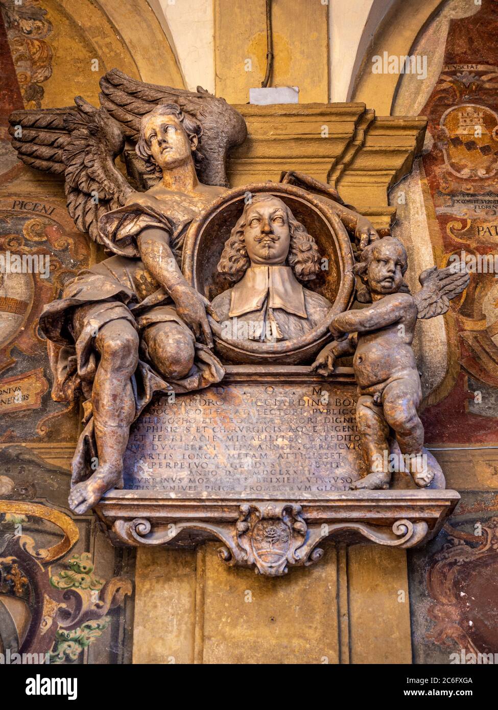 Carved plaque on the portico wall of inner courtyard of Archiginnasio ...