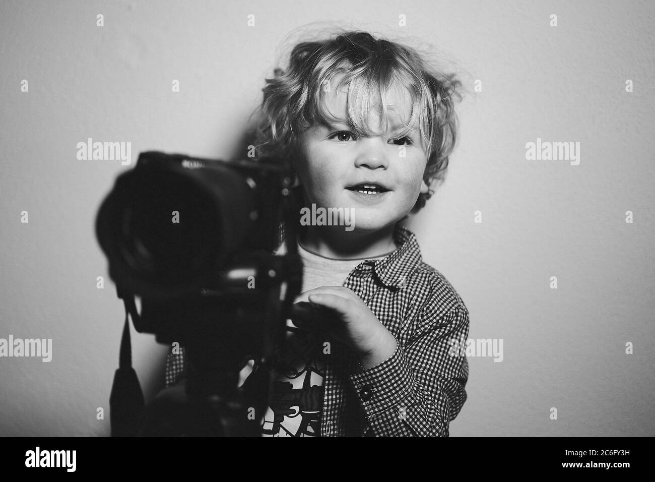Little boy teaching with camera Stock Photo - Alamy