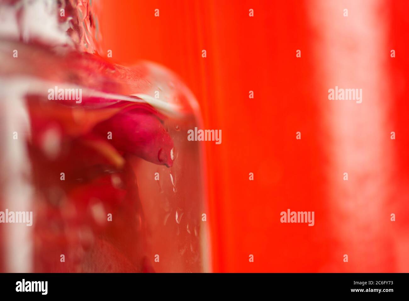 Perfumed rose water. Spa set with rose petals oil. Pink rose flower and ...