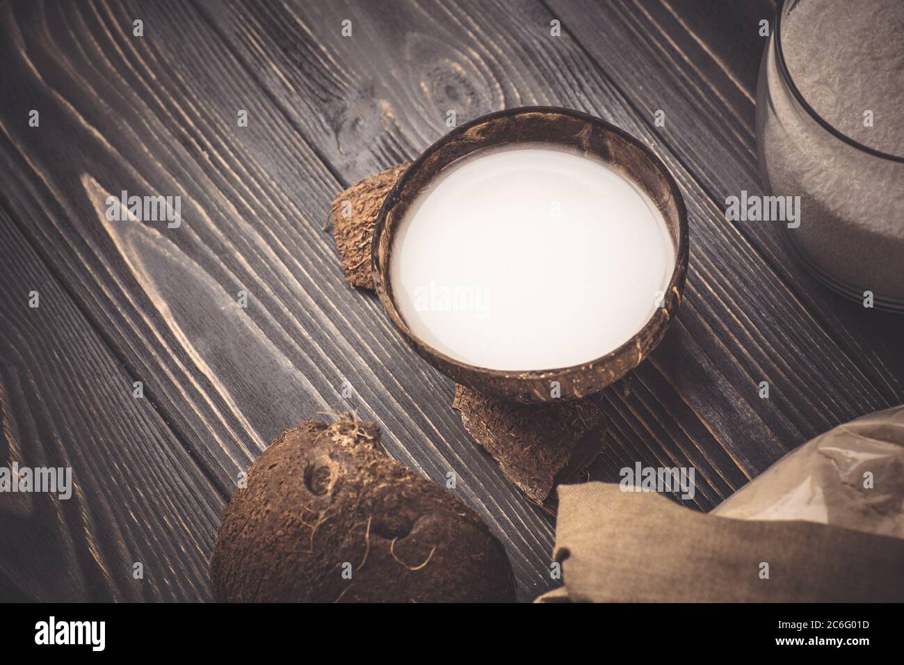 Coconut milk on a wooden background. Coconut and coconut milk. Fresh ...