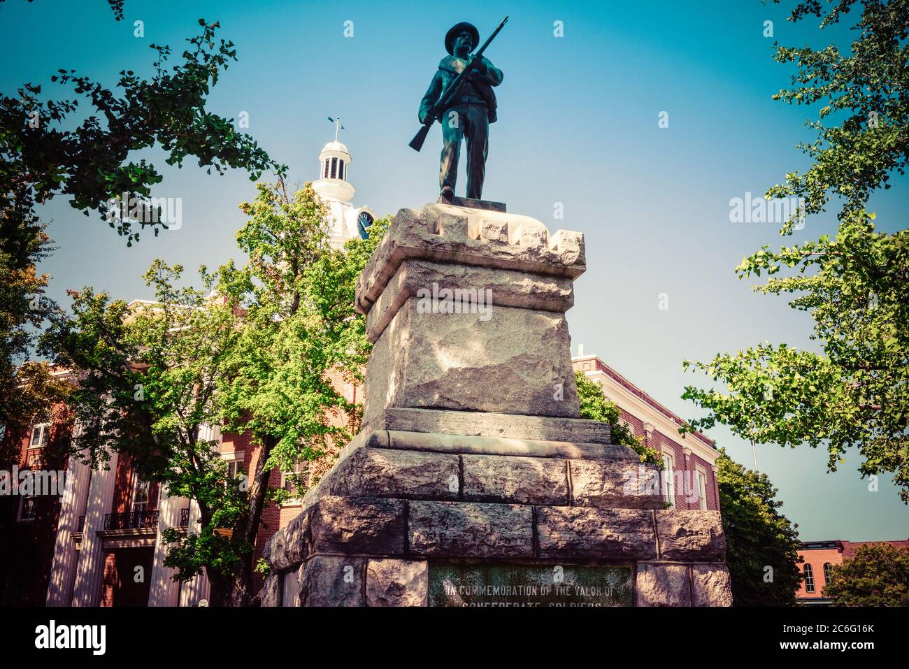 A commemorative Confederate Solider Statue on plinth base with plaque ...