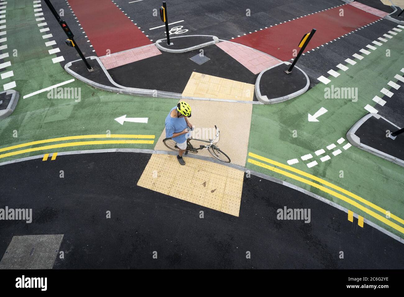 Manchester, Britain. 9th July, 2020. A cyclist waits for a traffic ...
