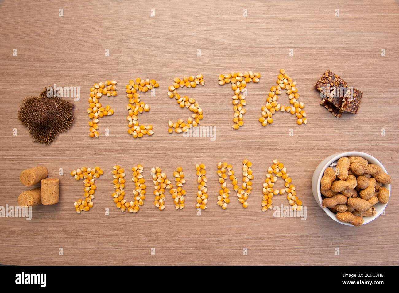 June party (Festa Junina) written with corn grains on wood. Traditional ...