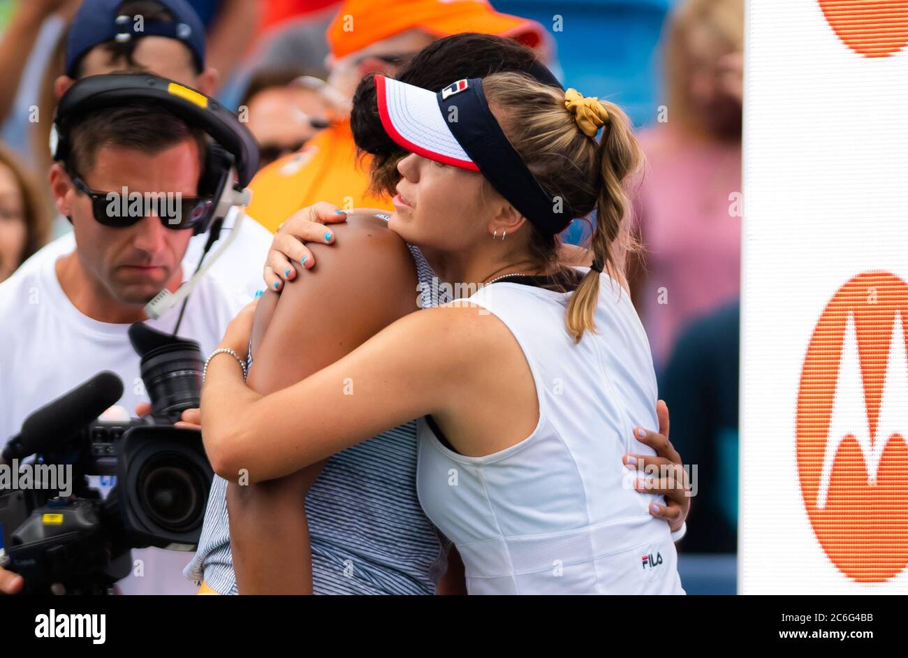 Naomi Osaka of Japan hugs Sofia Kenin after she is forced to retire ...