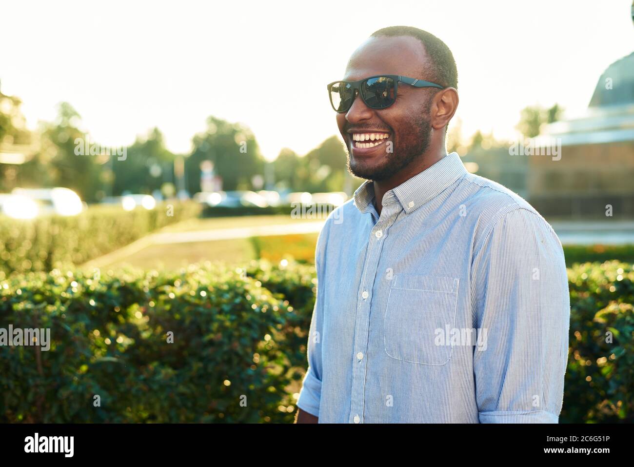Portrait of an African American businessman. Happy smiling man outdoors ...