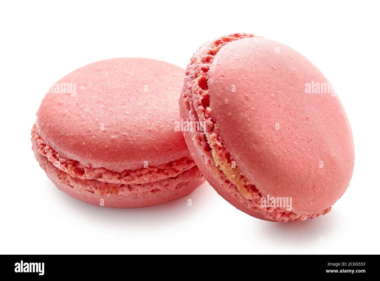 two pink macaroons isolated on white background Stock Photo - Alamy