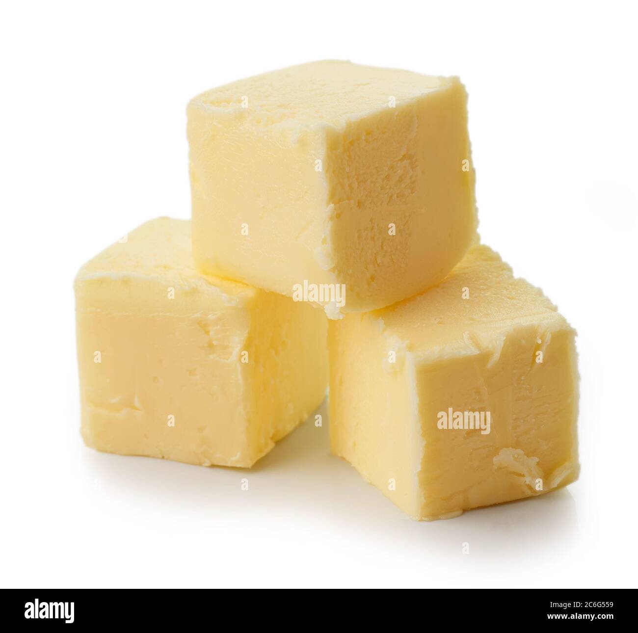 three pieces of butter isolated on white background Stock Photo - Alamy