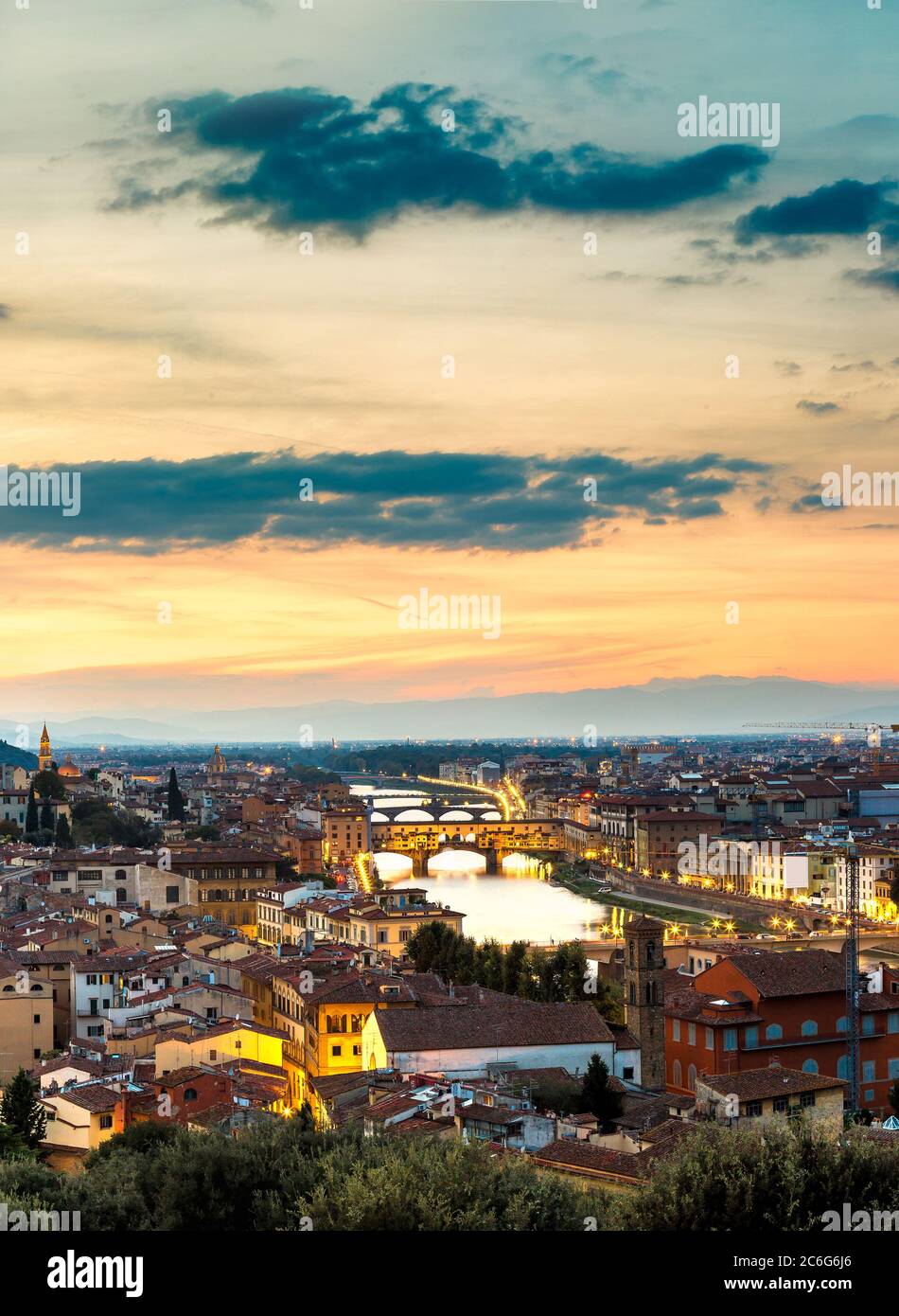 The Ponte Vecchio at sunset in Florence, Italy Stock Photo - Alamy