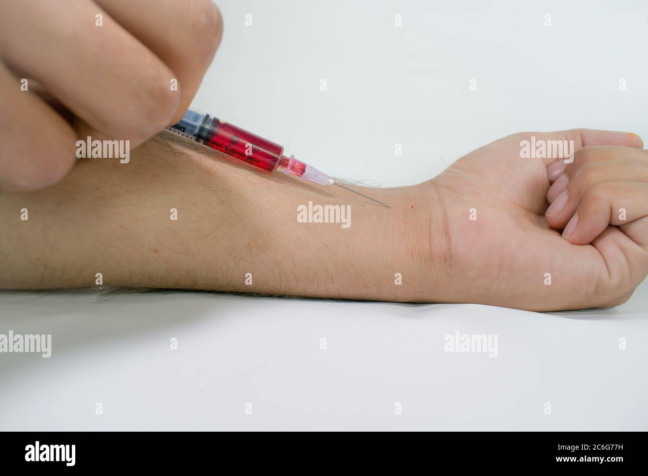 A doctor taking blood sample from patient Stock Photo - Alamy