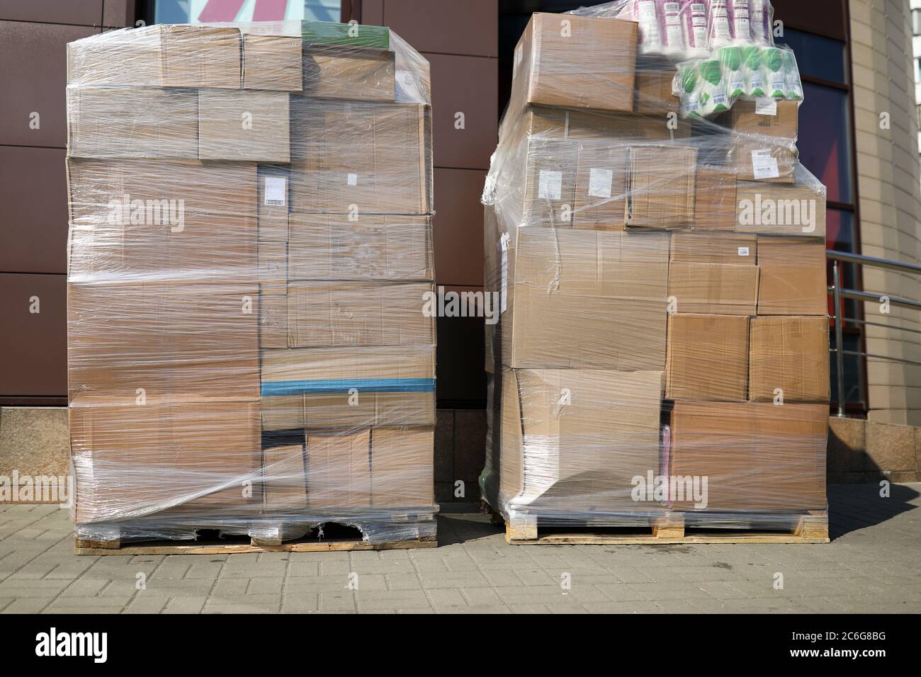 On city street are pallets with boxes in film Stock Photo - Alamy