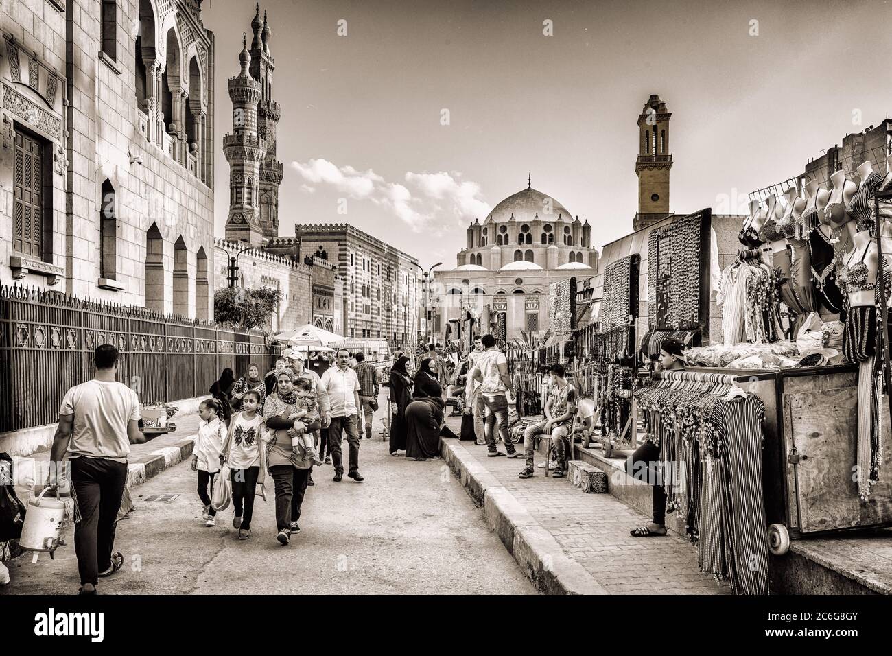 Crowds walking in Azhar Street in front of the main entrance to the Al ...