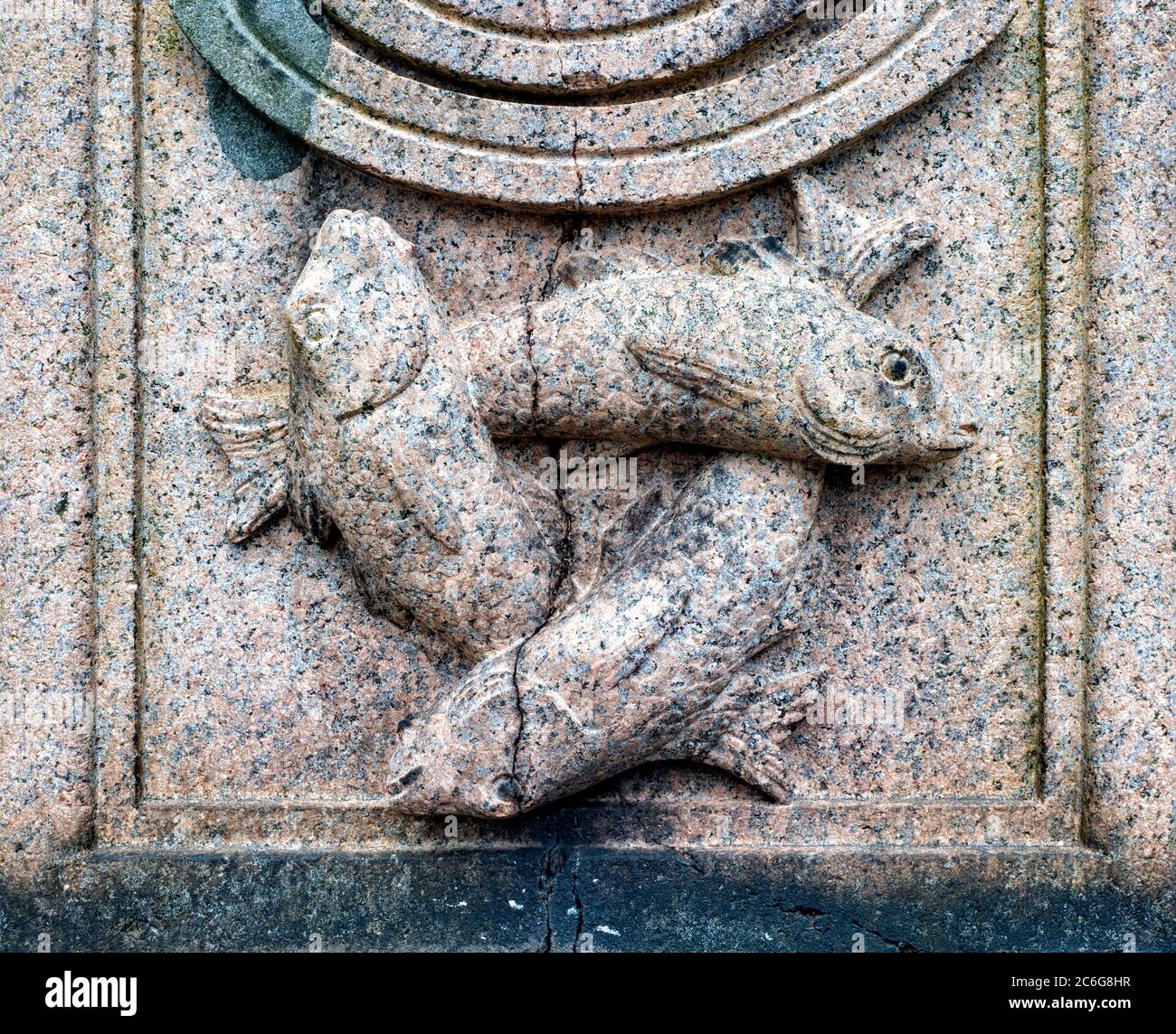 Detail of gravestone showing three intertwined fish Stock Photo - Alamy