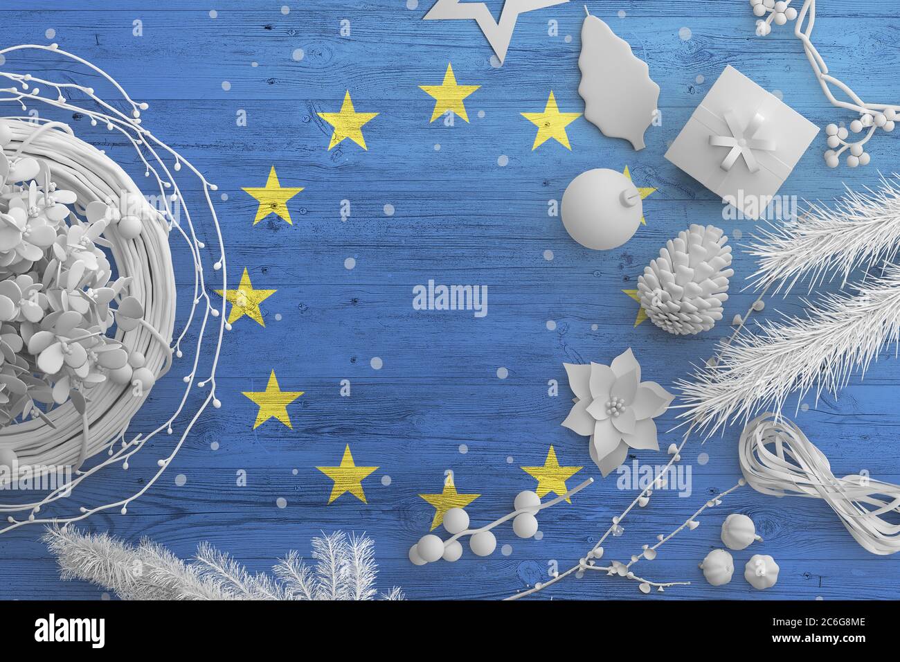European Union flag on wooden table with snow objects. Christmas and ...
