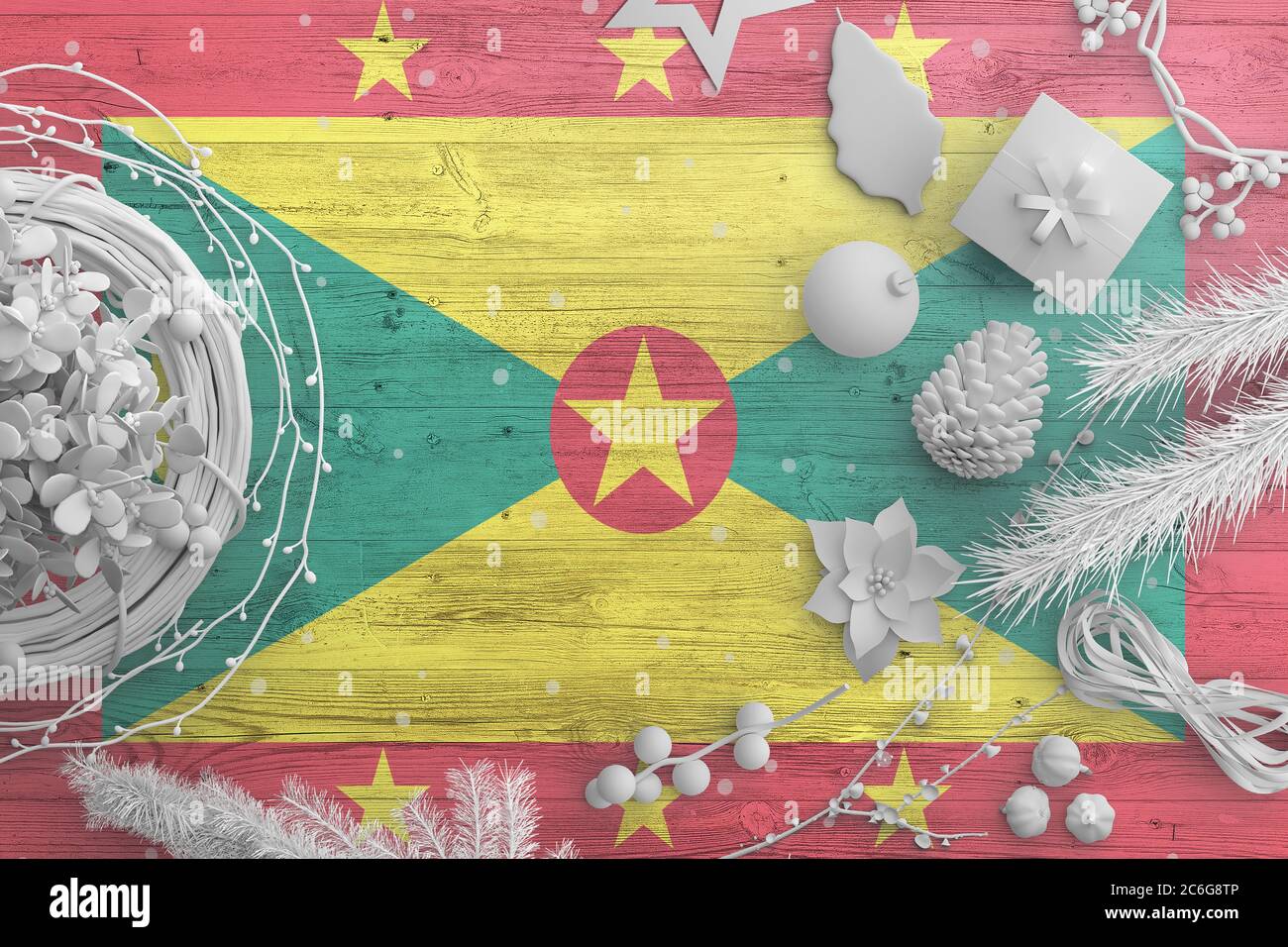 Grenada flag on wooden table with snow objects. Christmas and new year ...