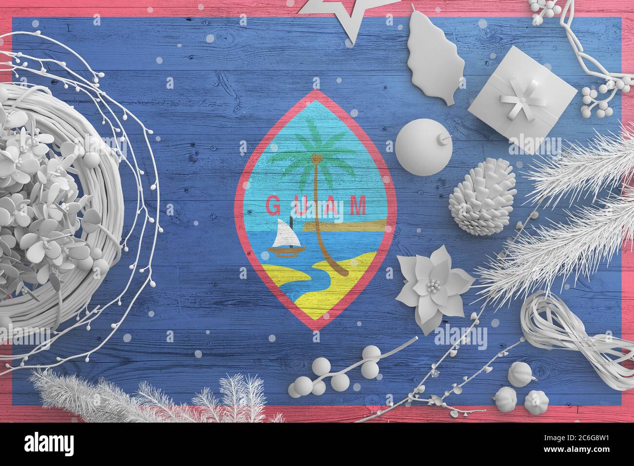 Guam flag on wooden table with snow objects. Christmas and new year ...