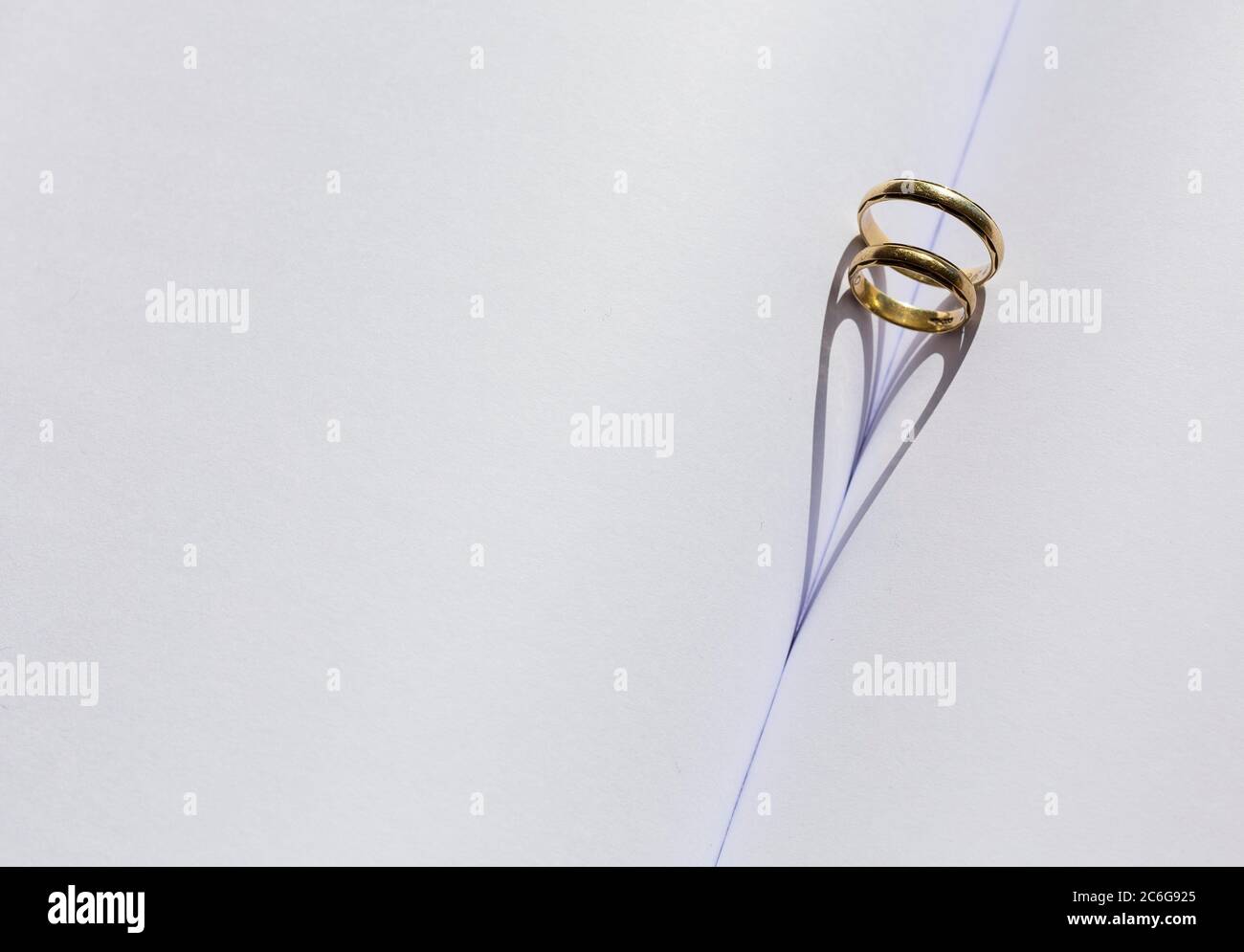 Two rings in the fold of an empty book hi-res stock photography and ...