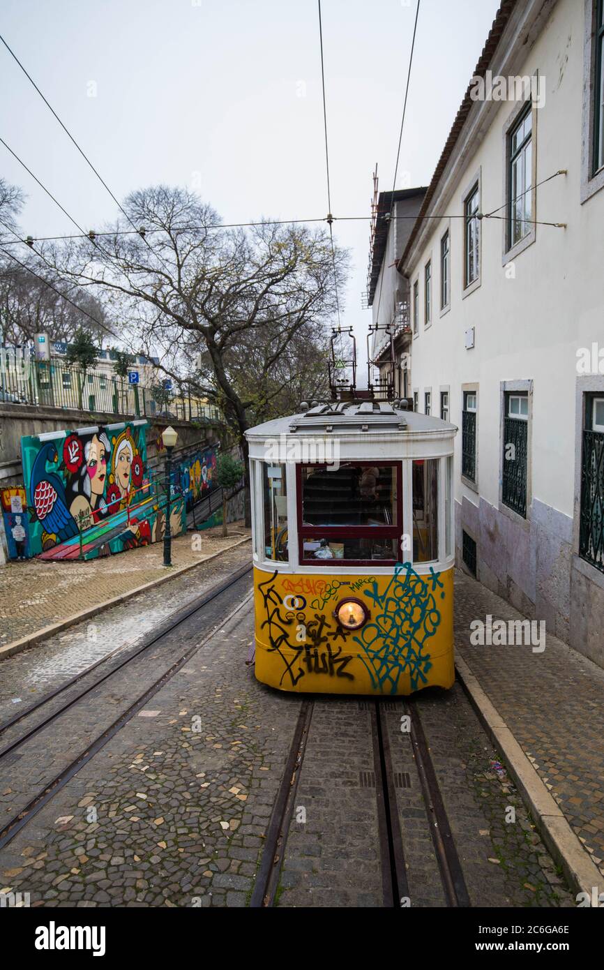 One of Lisbon's trams covered in graffiti Stock Photo - Alamy
