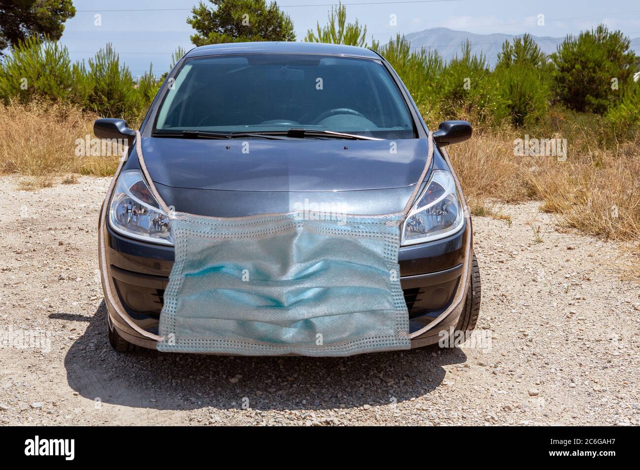 Covid19 Protected Car with Face Mask Stock Photo - Alamy