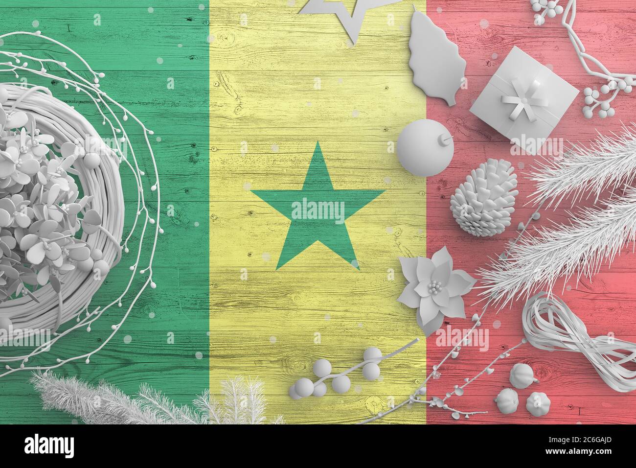 Senegal flag on wooden table with snow objects. Christmas and new year ...