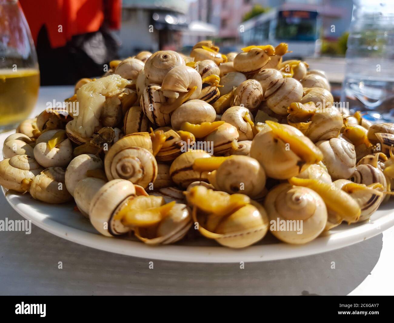 Plate with small cooked snails. A Typical portuguese appetizer Stock ...