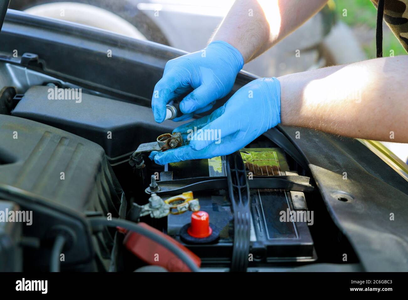 Mechanic repairs car repair station replacement car battery in service ...