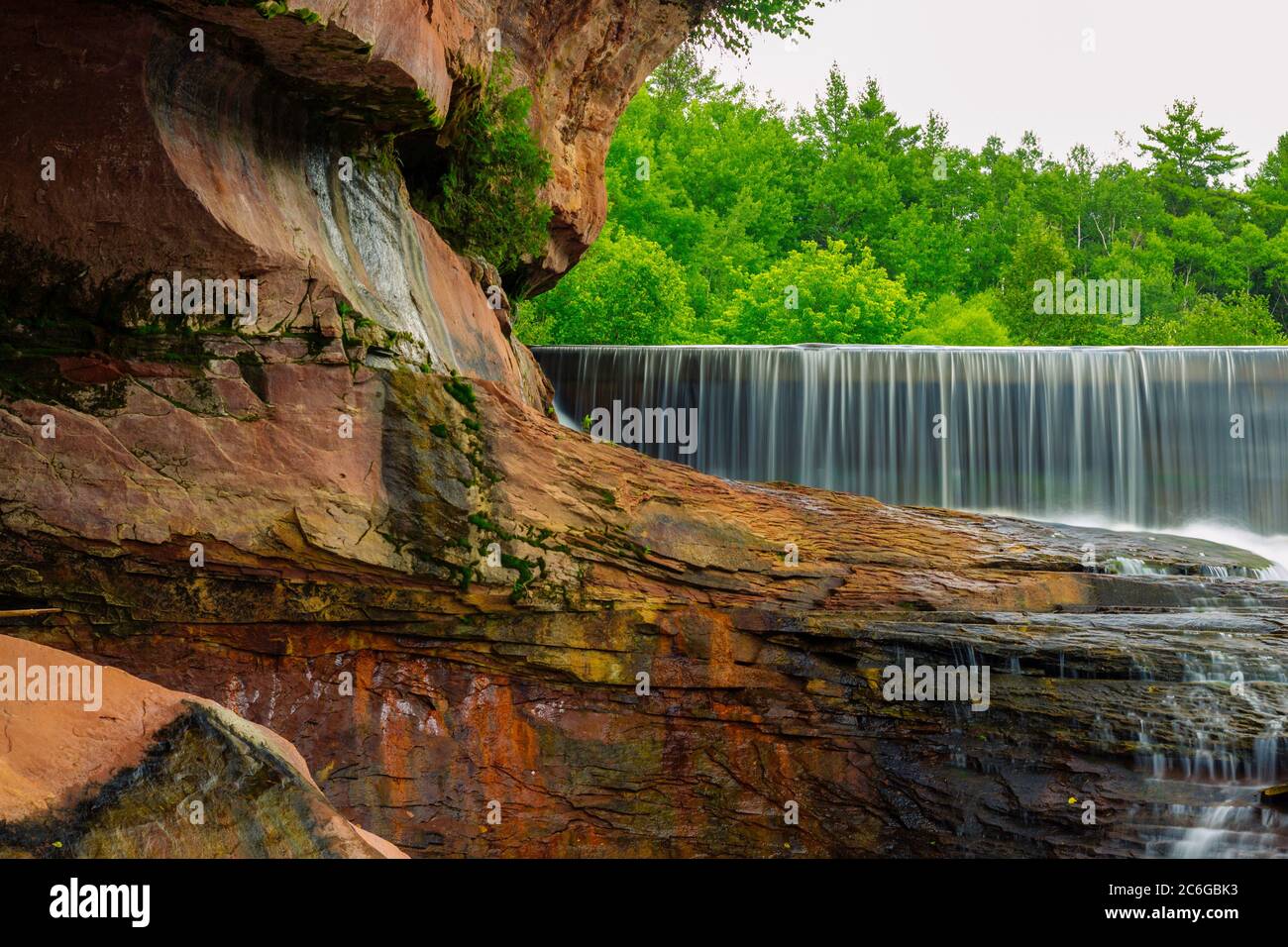 Small Waterfall Surrounded by Beautiful Ground Stone Rock Walls Stock ...