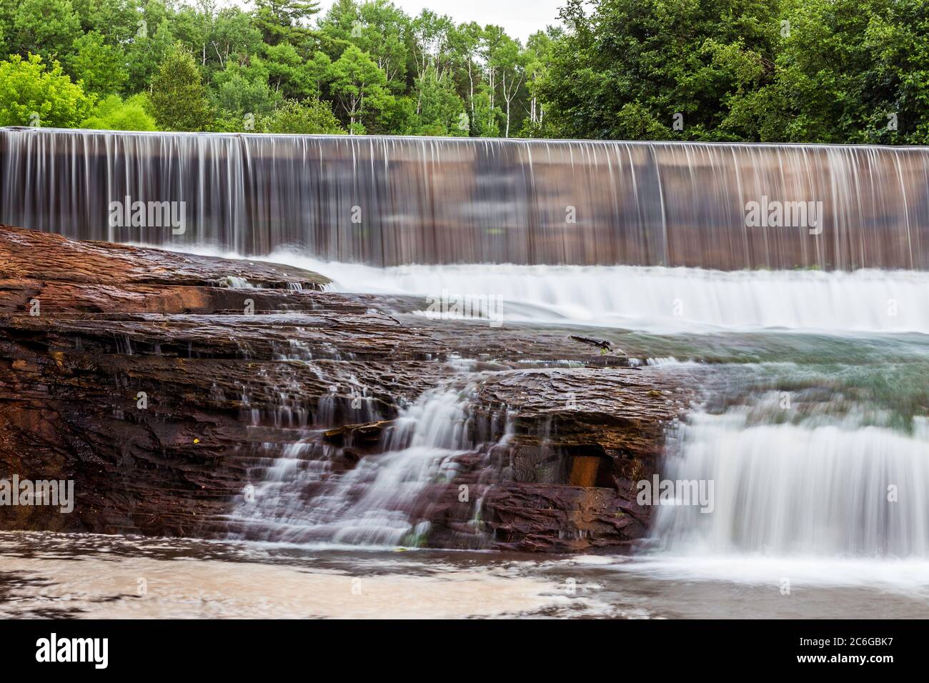 Small Waterfall Surrounded by Beautiful Ground Stone Rock Walls Stock ...