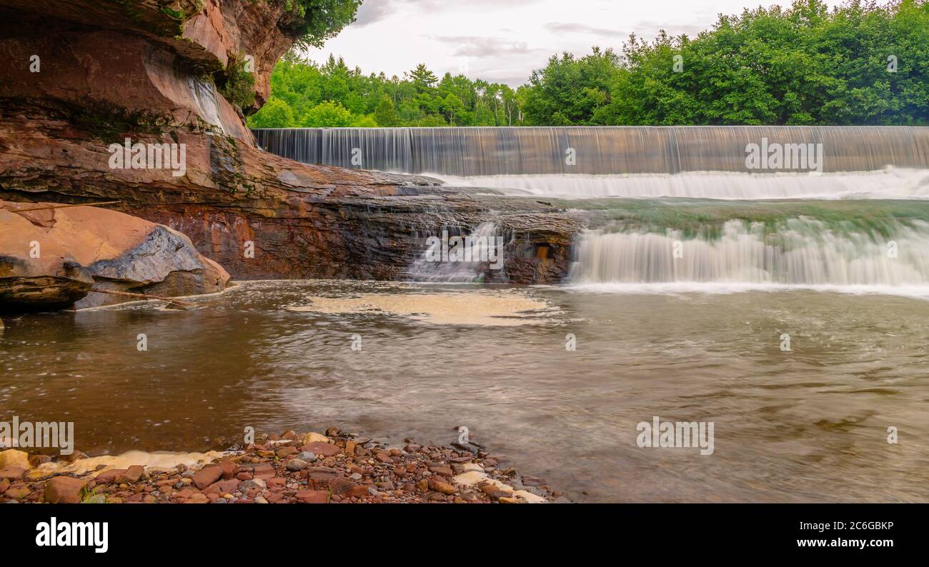 Small Waterfall Surrounded by Beautiful Ground Stone Rock Walls Stock ...