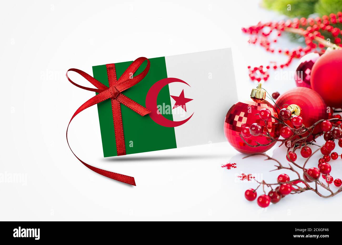 Algeria flag on new year invitation card with red christmas ornaments ...