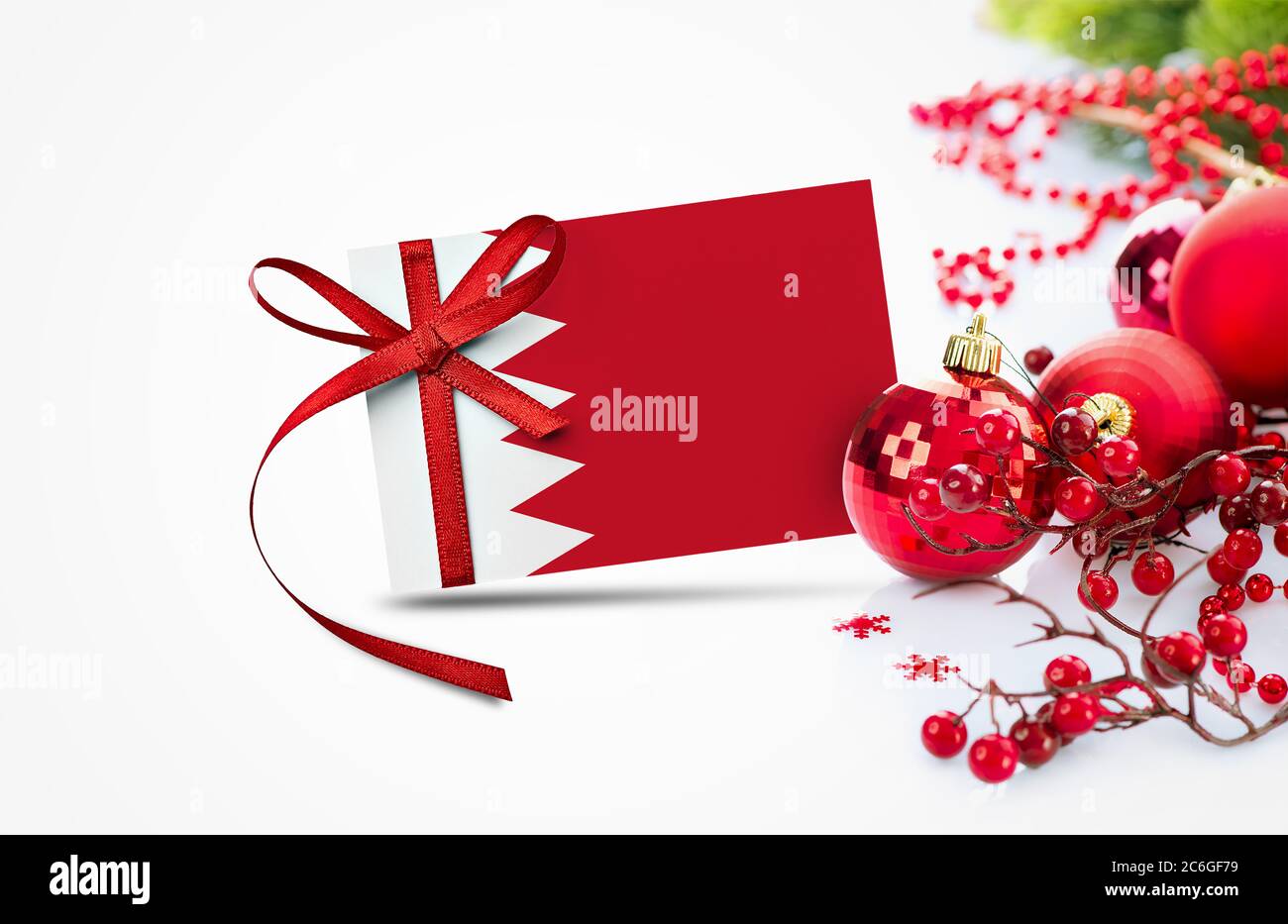 Bahrain flag on new year invitation card with red christmas ornaments ...