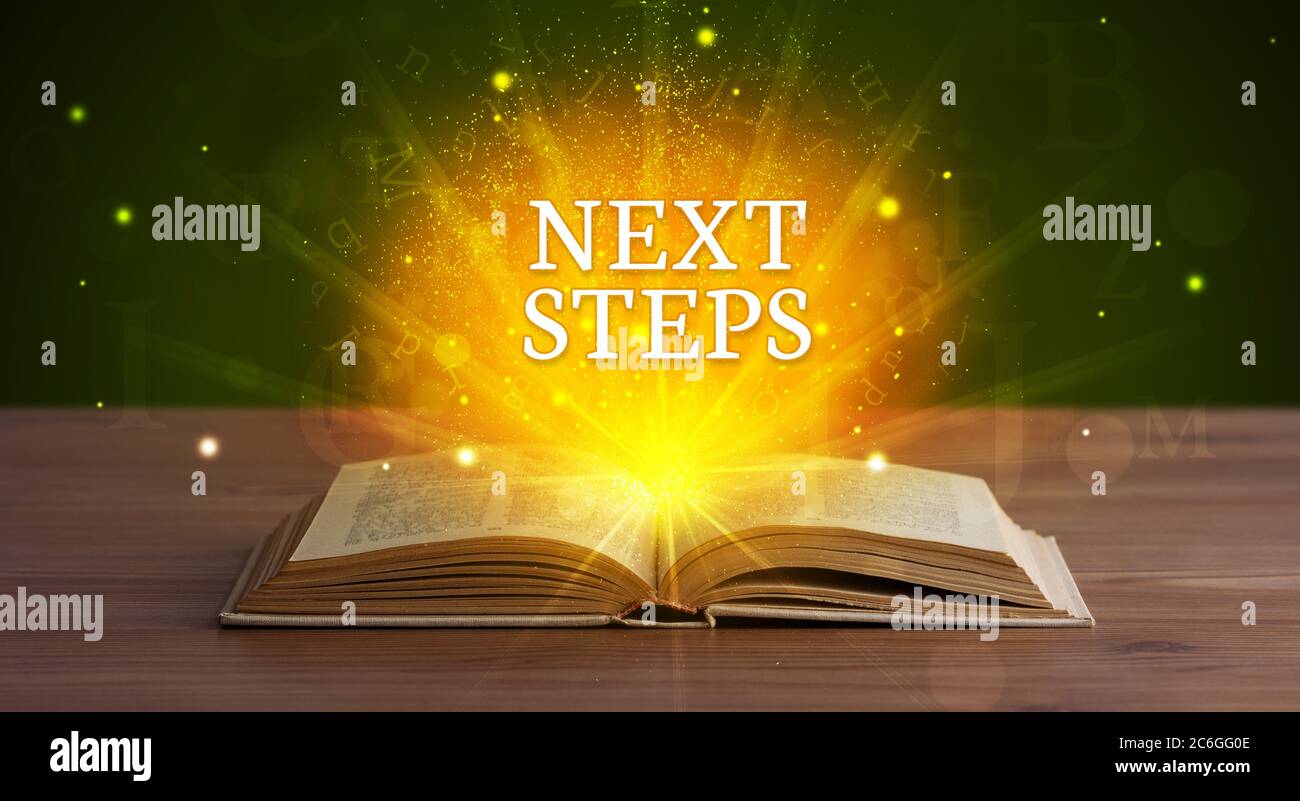 NEXT STEPS inscription coming out from an open book, educational ...