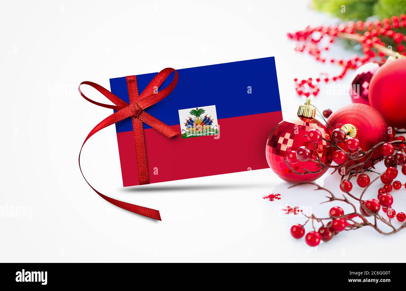 Haiti flag on new year invitation card with red christmas ornaments ...