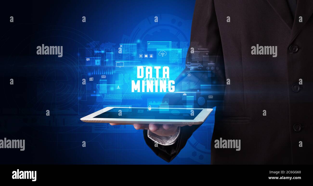 Young business person working on tablet and shows the digital sign ...
