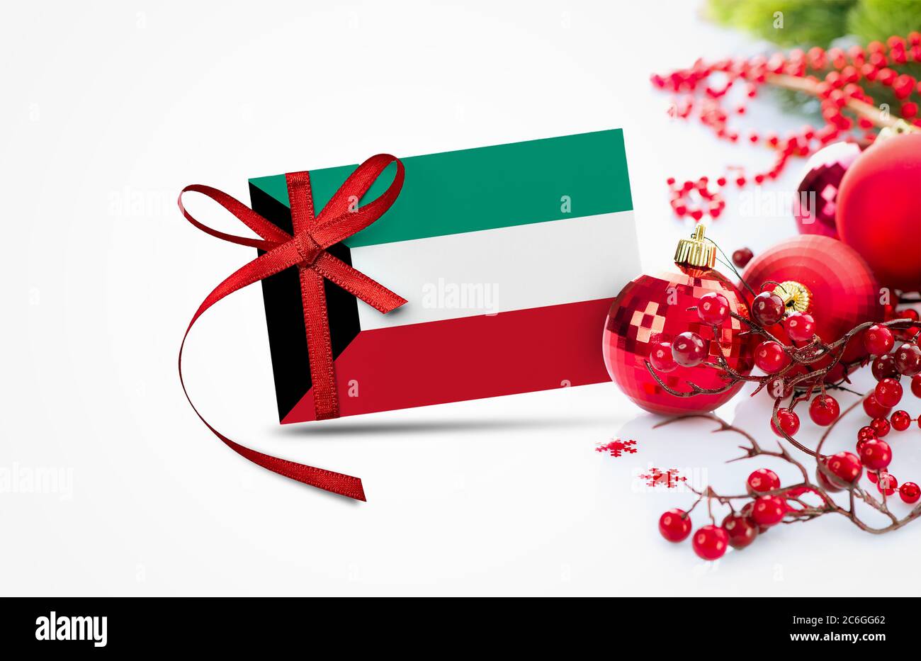 Kuwait flag on new year invitation card with red christmas ornaments ...