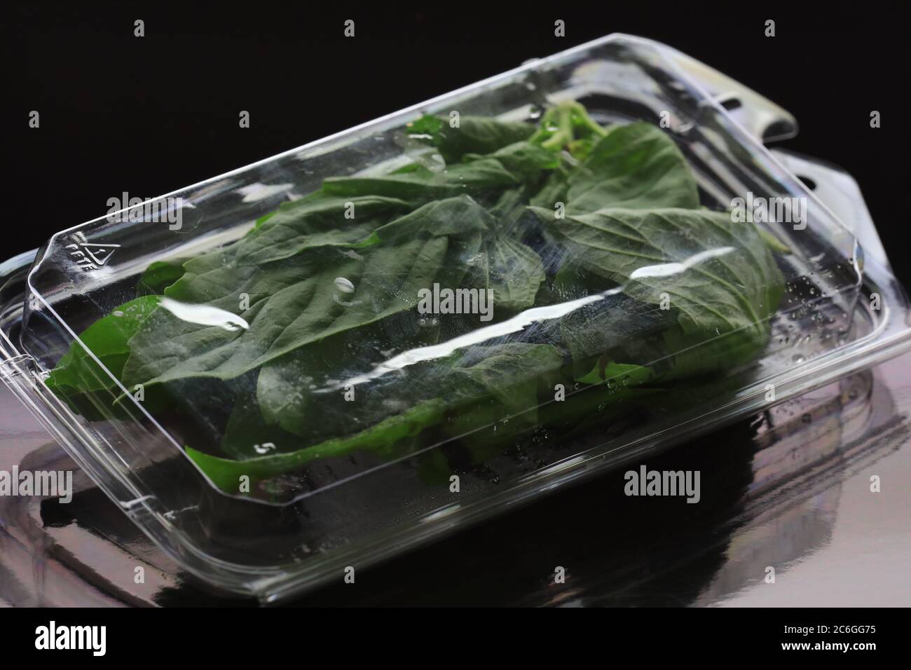 Fresh Basil leaves in a single use package Stock Photo - Alamy