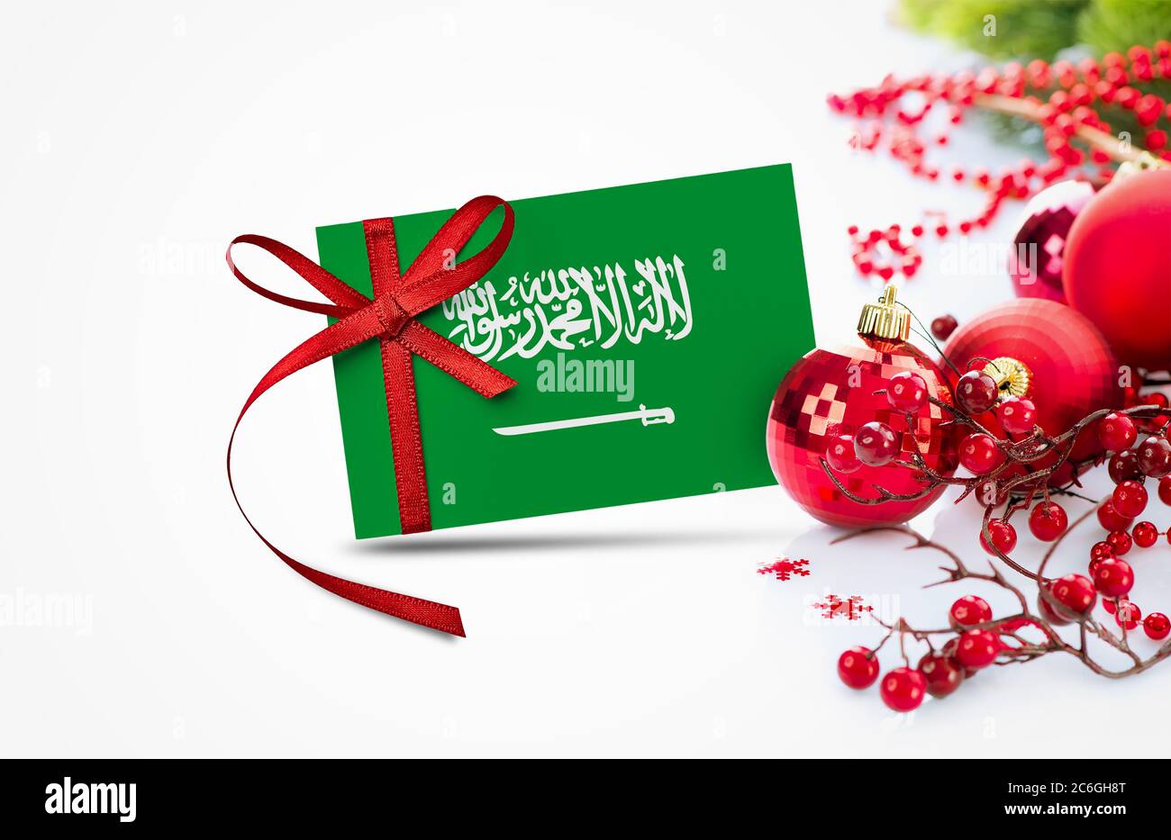 Saudi Arabia flag on new year invitation card with red christmas ...