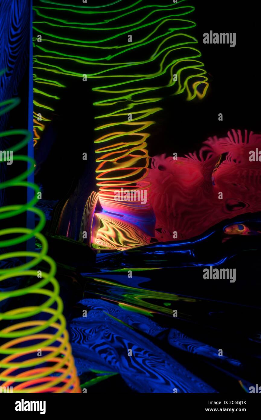 Fuzzy and circular objects in a close-up view and reflections are lit ...