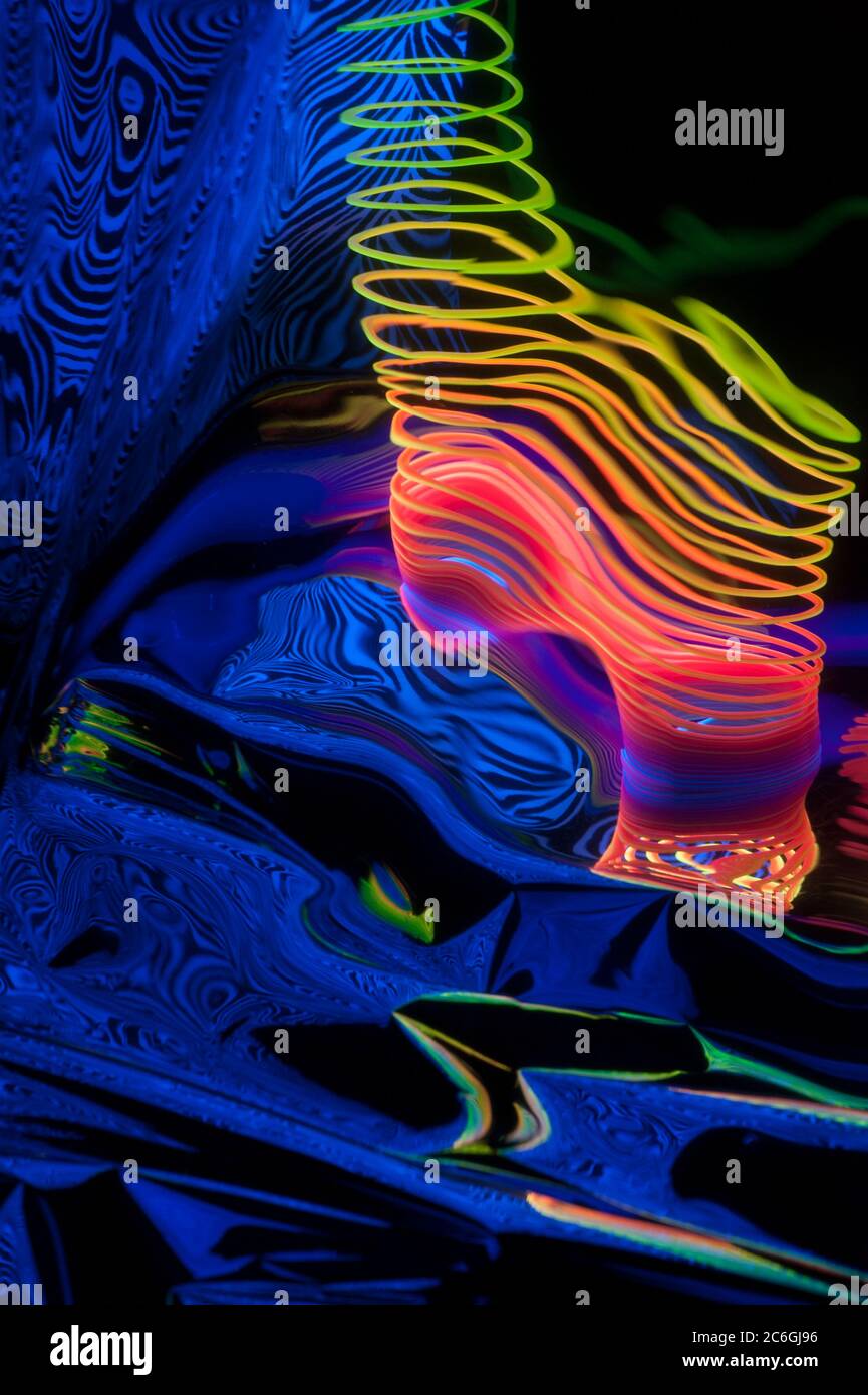 Fuzzy and circular objects in a close-up view and reflections are lit ...